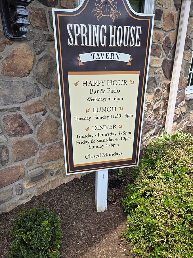 The hours posted on stone – a roadmap to happiness for hungry travelers seeking exceptional prime rib and seafood in Ambler.