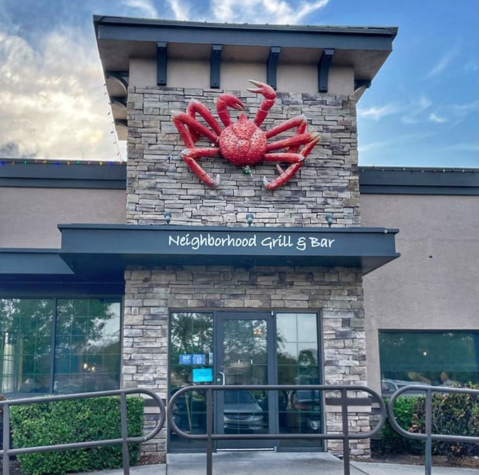 That iconic red crab against the sky isn't just a logo—it's a beacon guiding hungry travelers to seafood salvation.