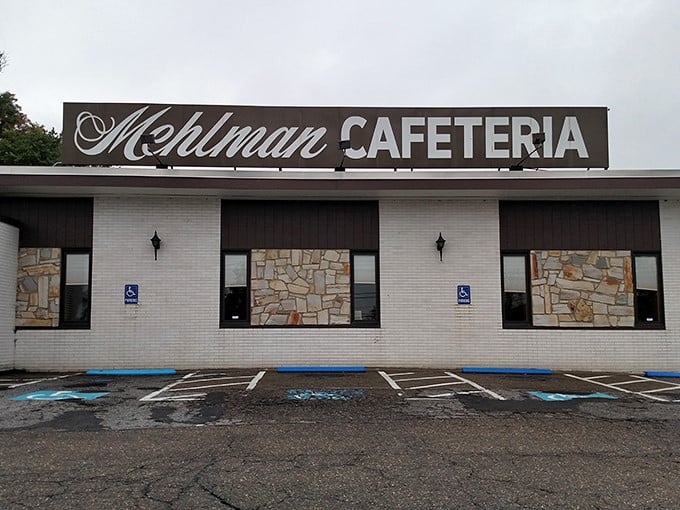Rain or shine, the Mehlman's sign beckons hungry travelers and locals alike—a beacon of culinary consistency in an ever-changing world.