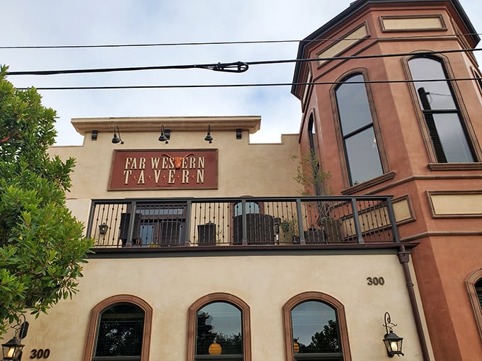 The restaurant's distinctive silhouette against the California sky. That balcony isn't just architectural flair—it's where food dreams and fresh air collide.