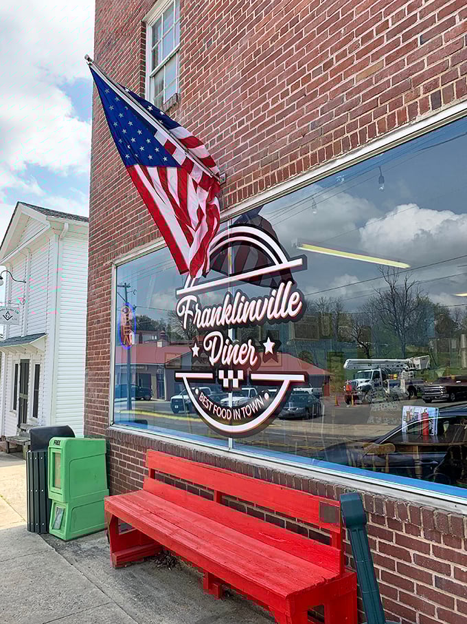 That red bench outside invites you to sit a spell – the diner's logo promising "Best Food in Town" isn't bragging, it's just stating facts.