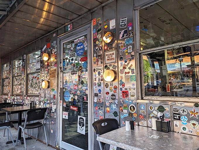 Every sticker on these windows represents a visitor who found something worth remembering—creating a collective memory wall of satisfied appetites and good times.