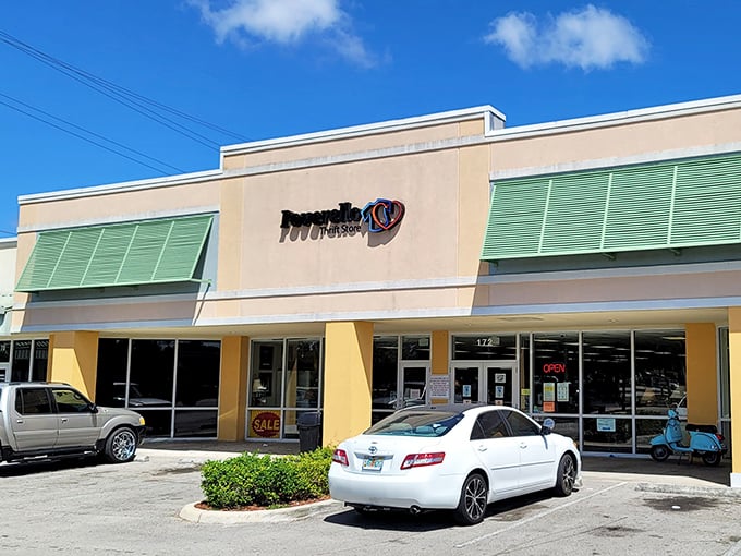 The exterior view on a perfect Florida day—blue skies above and bargain-hunting paradise below, just waiting for you to make your entrance.