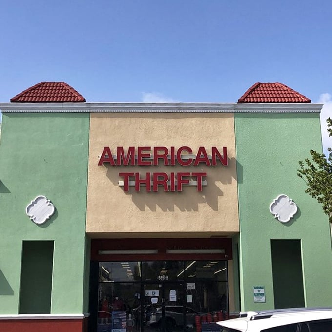 American Thrift under cloudless Florida skies—where the hunt for secondhand treasures is always in season. The red tile roofs add a touch of Mediterranean flair.