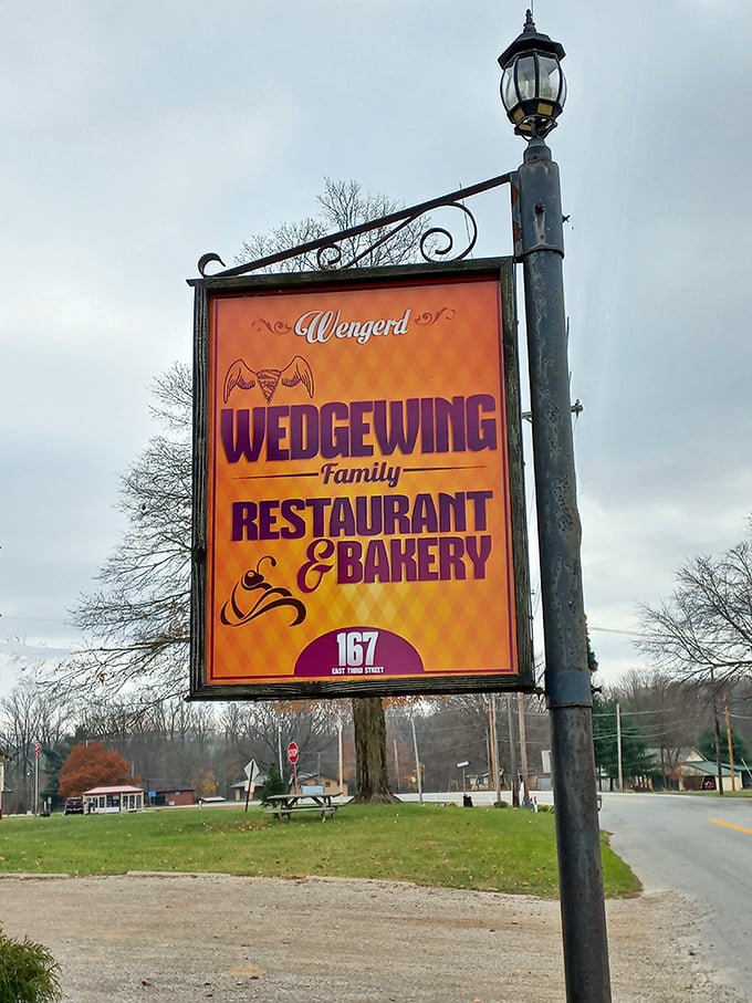 The sign that's guided hungry travelers for years. Orange and purple never looked so appetizing—or so promising.