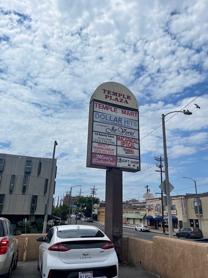 Even the street sign knows what's up – Dollar Hits gets top billing at Temple Plaza because flavor this good deserves marquee status.