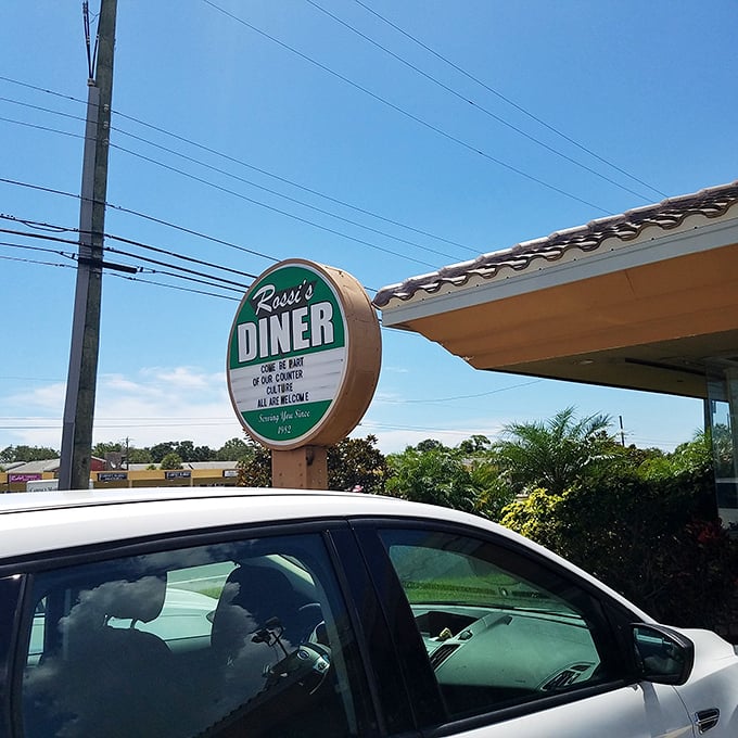 The sign that's guided hungry travelers like a culinary lighthouse. "Dine in or counter service" – six words that promise salvation for empty stomachs.
