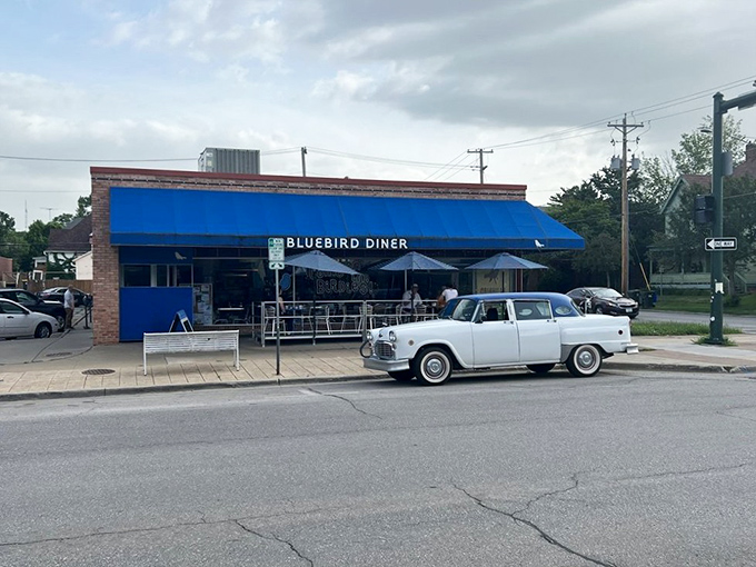 That vintage car parked outside isn't coincidental—it's a time machine companion to a diner that understands breakfast is timeless.