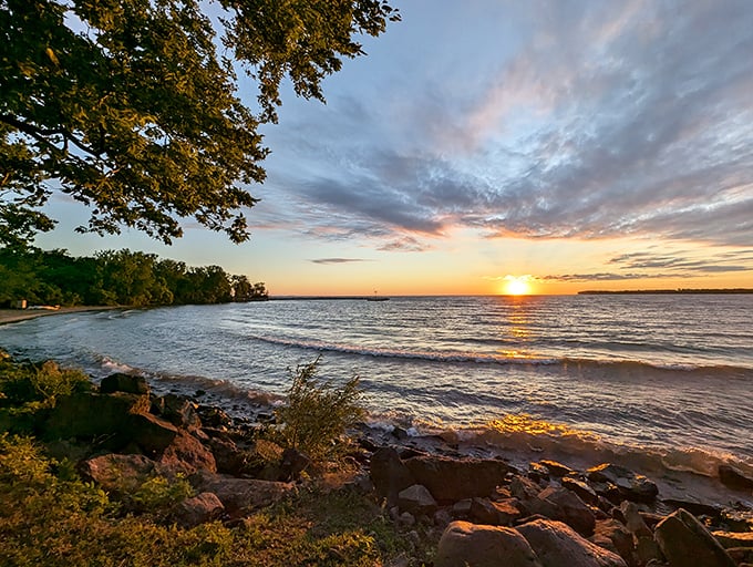 Lake Erie sunsets don't just end the day—they celebrate it with a technicolor farewell that makes you wonder why you ever thought beaches required salt water.