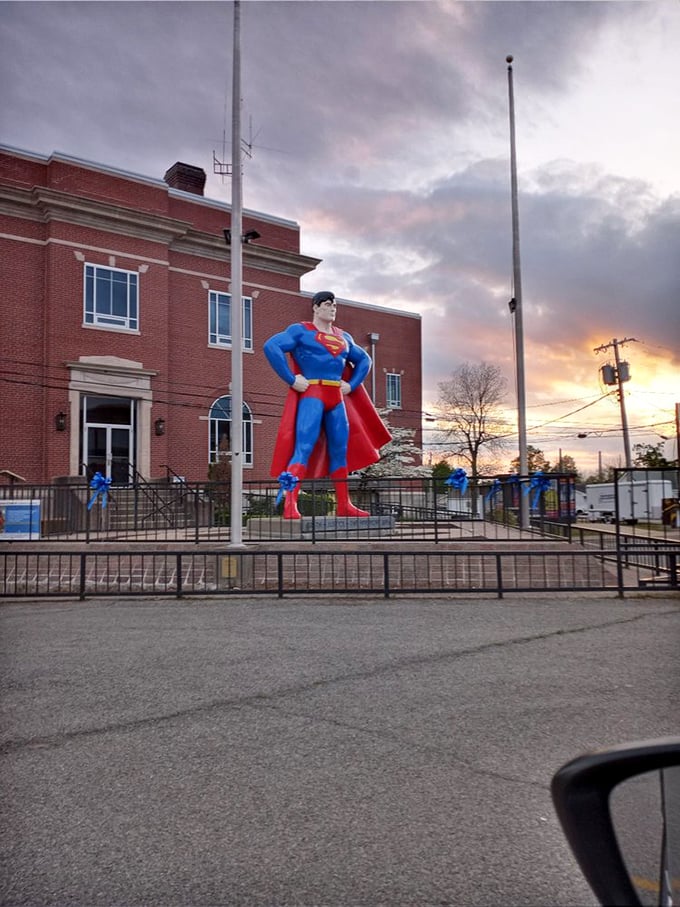 As the sun sets over Metropolis, Superman's silhouette stands dramatic against the twilight sky—a perfect end to any hero's journey.