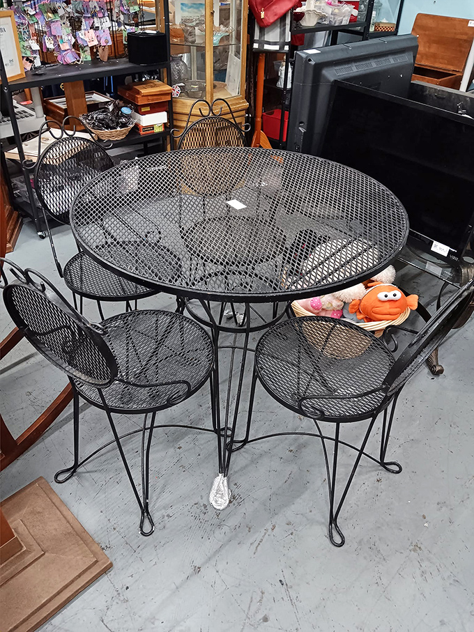 This vintage patio set has witnessed countless summer conversations and stands ready for many more, orange plush toy included at no extra charge.