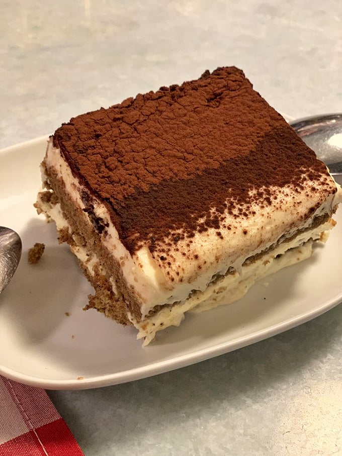 The legendary tiramisu—architectural perfection of coffee-soaked ladyfingers and mascarpone cream that justifies the cross-state pilgrimage.