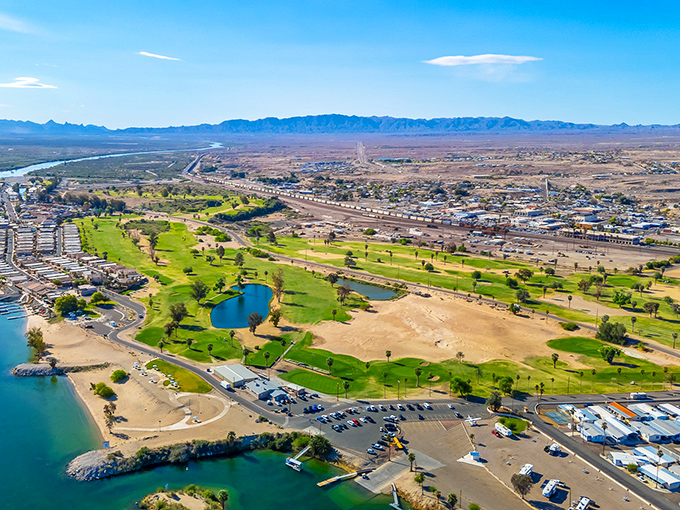 From above, Needles reveals its true oasis character—a green golf course and blue waters carving life into the desert landscape. Nature's most dramatic before-and-after picture.