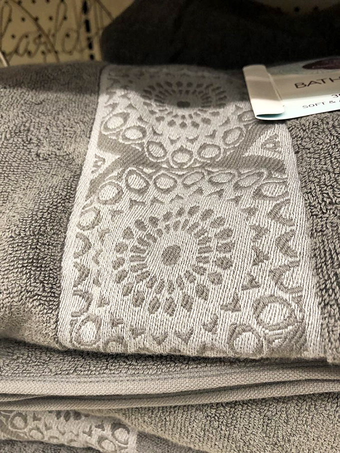 Embossed towels with intricate patterns prove luxury doesn't require luxury pricing – bathroom upgrades that feel indulgent while remaining sensible.