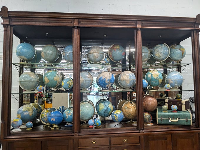 A cabinet of vintage globes where you can find countries that don't exist anymore—geography lessons with a side of nostalgia.