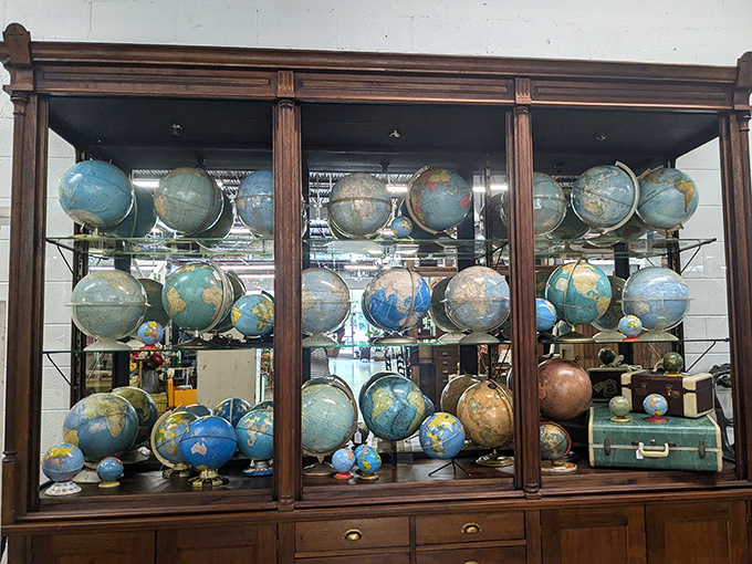 A cabinet of vintage globes where you can find countries that don't exist anymore—geography lessons with a side of nostalgia.