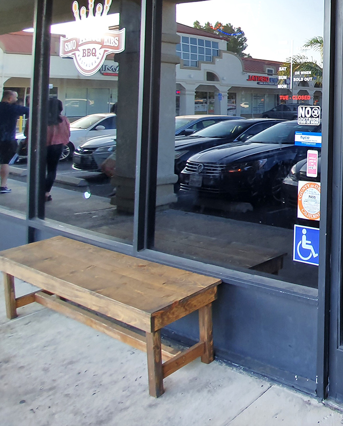 The humble bench outside speaks volumes – sometimes the wait is part of the experience. Good things come to those who wait, better things to those who make reservations.