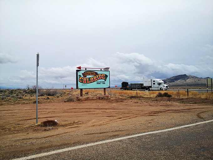 Highway signage points the way to Arizona's hidden treasure – a town where the past isn't just remembered, it's still being lived.