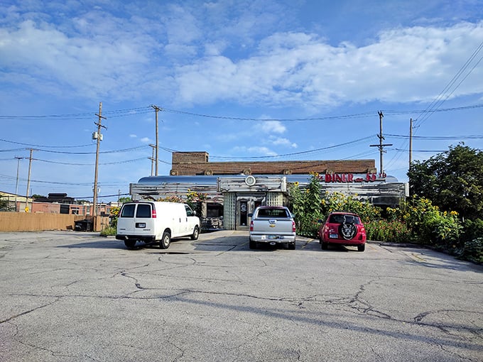 The parking lot view reveals the diner's true superpower—looking exactly like the place where memories are made and hunger is conquered.