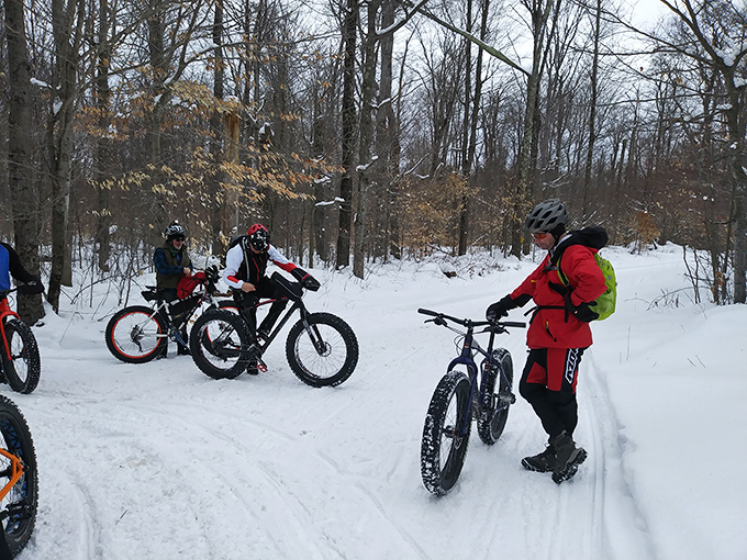 Fat-tire bikes carve through pristine snow, proving that winter in Pennsylvania isn't about hibernation – it's about adaptation and really good outerwear.