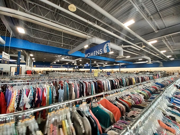 The women's section stretches toward the horizon like a textile rainbow, each garment with its own story and possible future.