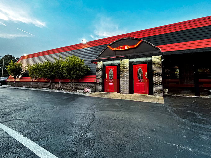 That bold red roof isn't just for show – it's like a beacon calling steak lovers home for dinner.