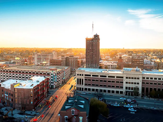 Aurora's skyline glows at sunset, showcasing the city's blend of historic charm and modern development where affordable homes await.