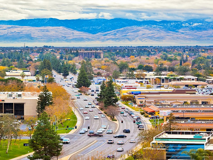 Look at those mountains playing peek-a-boo with Bakersfield's skyline - nature's own backdrop for city living!