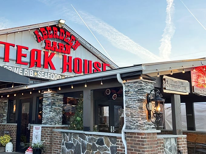 The iconic red signage of Aberdeen's Barn promises a steak experience that lives up to its bold declaration. Historic brick meets modern culinary magic.