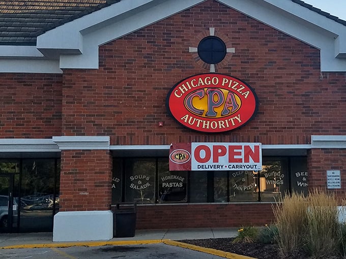 That brick facade promises serious pizza business – like a fortress protecting cheesy treasures inside.