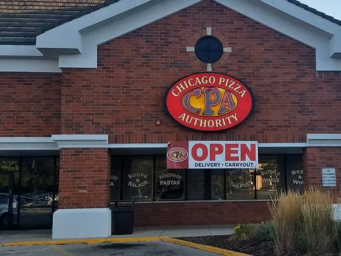 That brick facade promises serious pizza business – like a fortress protecting cheesy treasures inside.