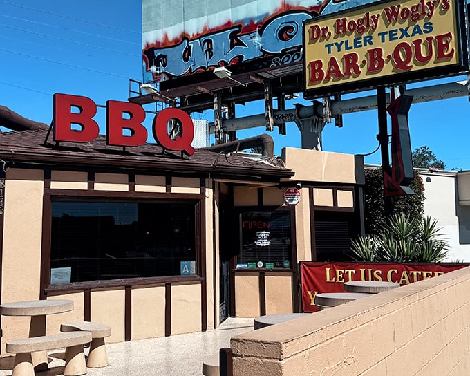That towering BBQ sign isn't just advertising – it's a smoky beacon calling all rib lovers home.