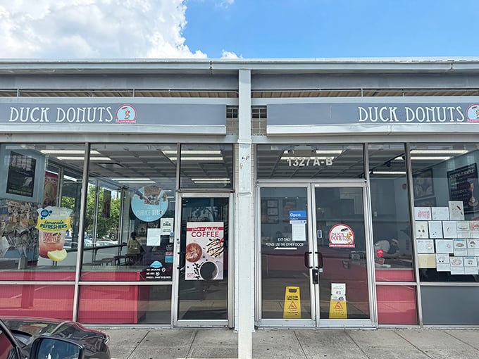 The storefront beckons with promise – a temple of customizable fried dough where dreams come true, one topping at a time.