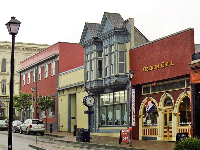 Victorian charm with a side of seafood! Eureka's Oberon Grill beckons beneath moody skies, where that magnificent blue bay window whispers tales of Gold Rush glory.