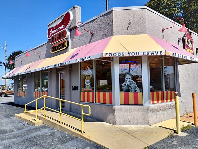 Johnnie's Dog House beckons with its cheerful awning – a time capsule of comfort food where calories don't count and memories are made.