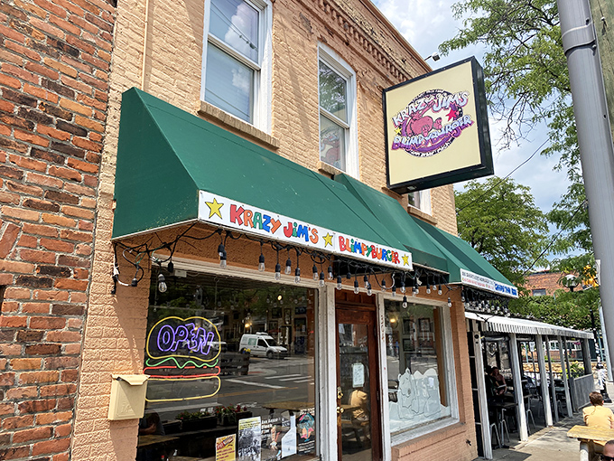 That cheerful green awning beckons like a siren call to burger lovers everywhere.