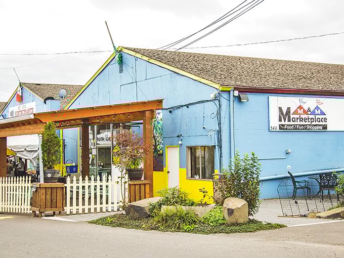 The colorful facade of M&M Marketplace beckons like a treasure chest waiting to be opened. That rainbow fence isn't just decoration—it's a promise of the vibrant finds inside!