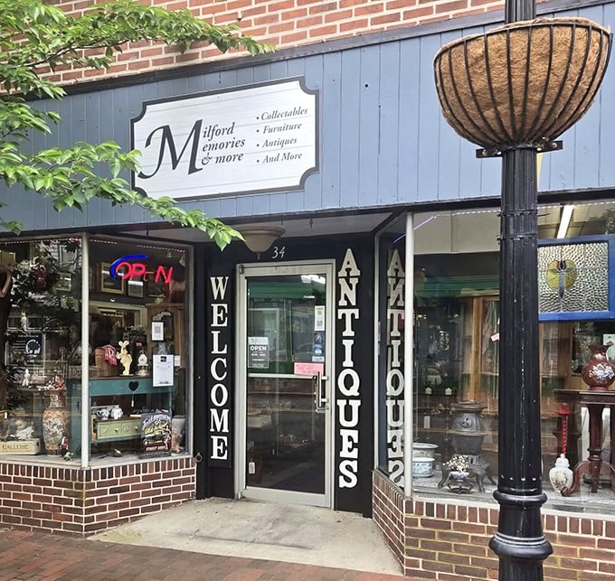 The blue storefront of Milford Memories beckons like an old friend. "Welcome Antiques" isn't just a sign—it's a promise of treasures waiting inside.