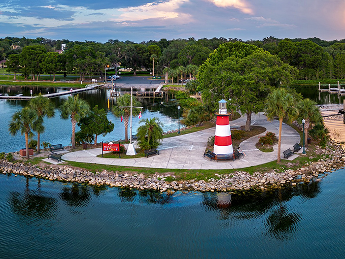 Mount Dora's charming lighthouse replica stands like a beacon of small-town Florida magic on Lake Dora's pristine shores.
