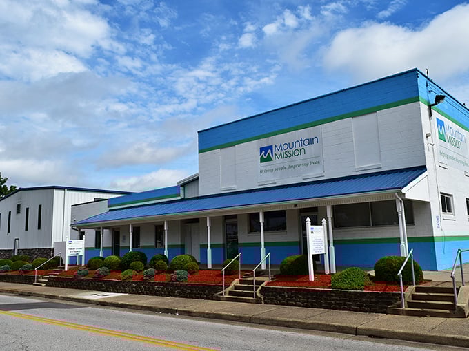 Mountain Mission's blue and white exterior stands like a bargain beacon in Charleston. This thrifting paradise promises treasures behind those welcoming doors.
