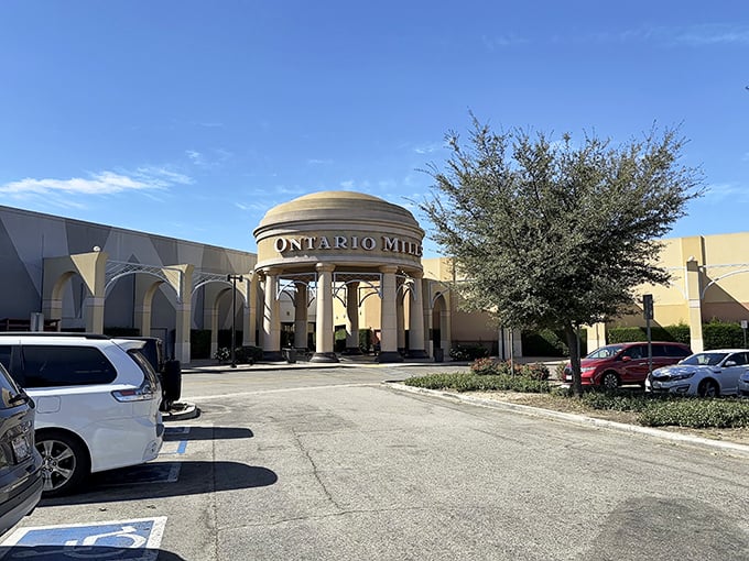 The grand entrance to Ontario Mills beckons like a retail Taj Mahal. Those columns aren't just for show—they're gateways to bargain paradise!