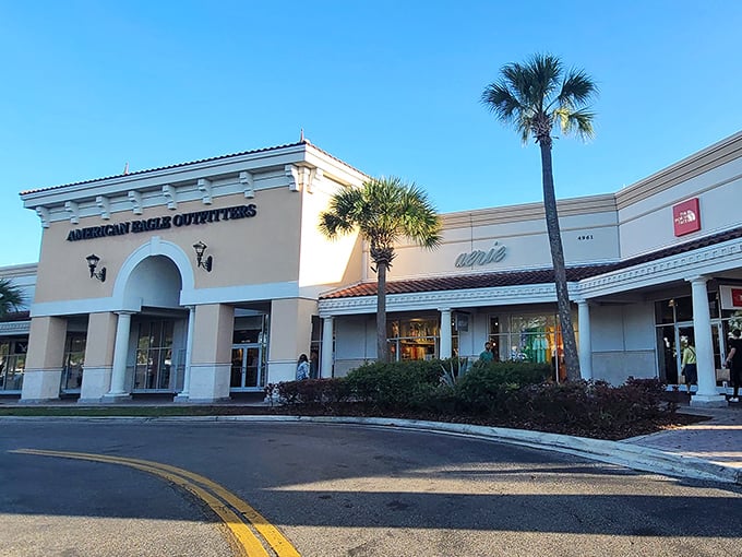 Look at those palm trees standing guard! This Mediterranean-style entrance whispers "expensive" but the prices inside shout "bargain!"