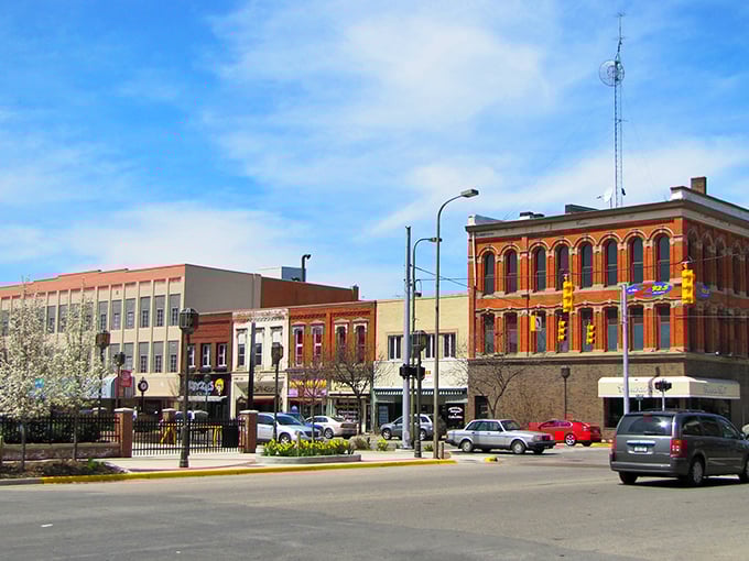 Downtown Owosso's historic brick buildings stand like friendly sentinels, guarding your retirement savings with their timeless charm and affordable appeal.