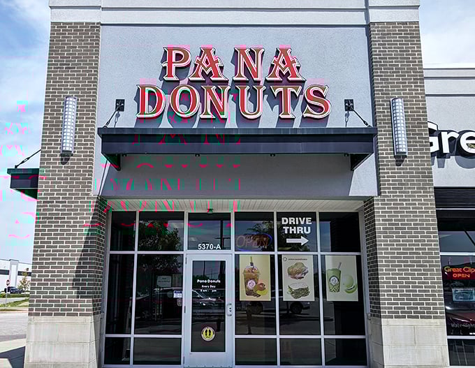 That gleaming storefront promises donuts so fresh, they're practically still warm from the fryer's loving embrace.