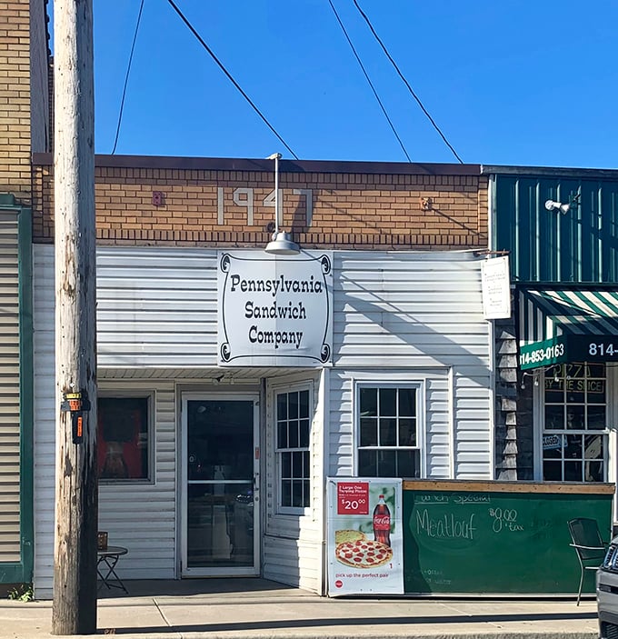 Sometimes the best treasures hide behind the simplest storefronts - this white building holds sandwich magic.