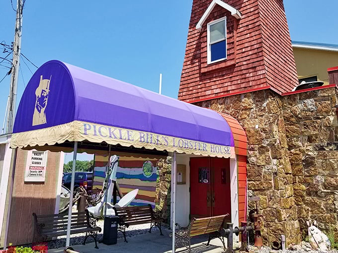 Pickle Bill's iconic lighthouse tower and purple awning – where seafood dreams and quirky architecture create the perfect Ohio paradox.