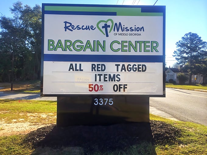 The Rescue Mission Bargain Center sign promises 50% off red-tagged treasures – like a scavenger hunt where everyone wins!