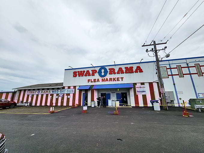 The red and white striped façade of Swap-O-Rama looks like a carnival of bargains waiting to happen!