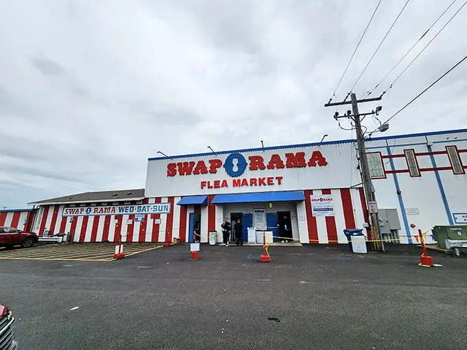 The red and white striped façade of Swap-O-Rama looks like a carnival of bargains waiting to happen!