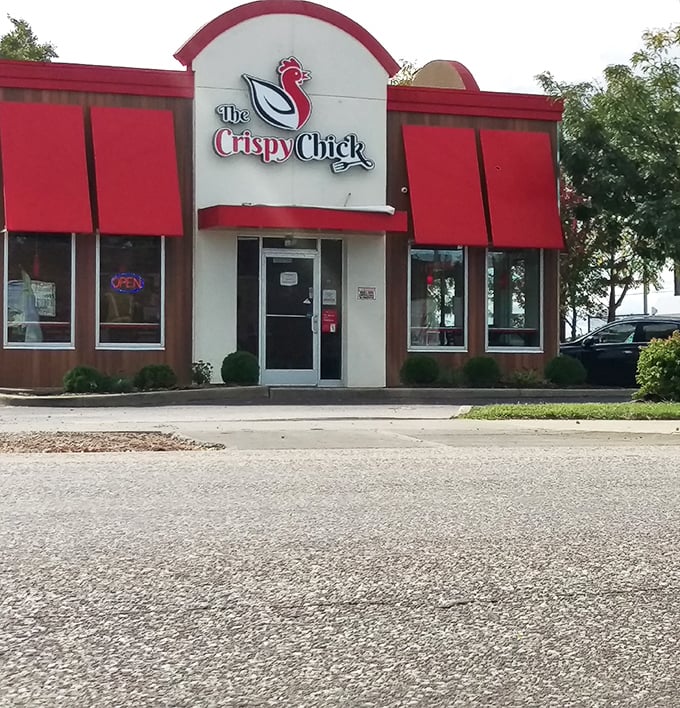 That red and white storefront isn't just pretty – it's your beacon to crispy chicken paradise.